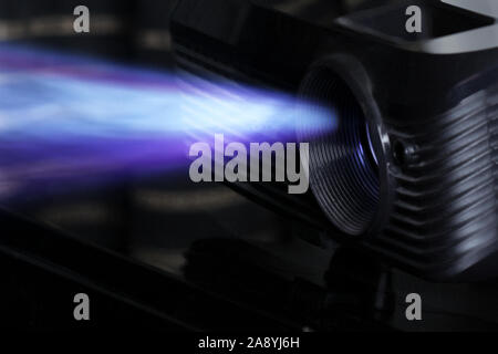 beamer light shining with a bright beam Stock Photo - Alamy