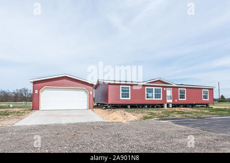 New manufactured home with red vinyl siding and windows with white ...