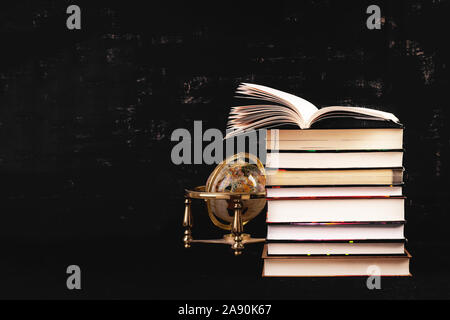 Stack of different books on dark background. Knowledge concept Stock ...