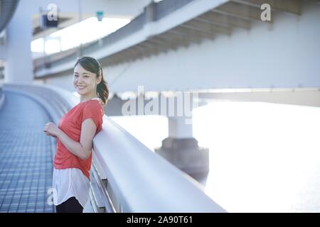 Young Japanese Woman Running Downtown Tokyo, Japan Stock Photo - Alamy