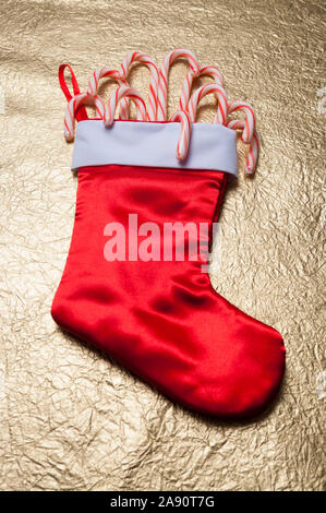 Simple Christmas stocking on festive gold background Stock Photo - Alamy