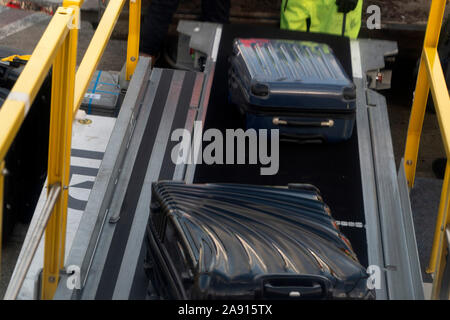 bags trolley luggage loading on airplane Stock Photo - Alamy