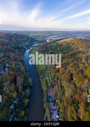 Aerial view of the River Wye, autumn trees and the ruins of an ancient ...