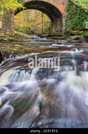 The waters of May Beck tumbling under the bridge on their way to ...
