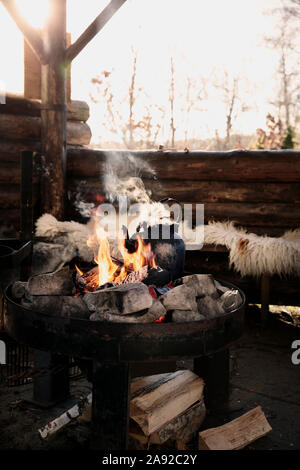 Vertical image of embers of a burning log creating a fiery background ...