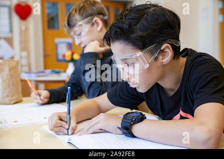 Boys in classroom Stock Photo - Alamy