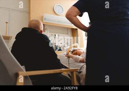 Man and woman in the delivery room during childbirth, the woman is ...