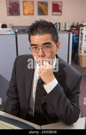 African American man with Autism working on computer in an office Stock ...