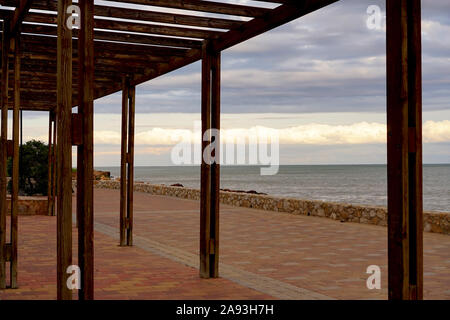 Outdoor communal wooden pergola passageway with a seaside view Stock ...