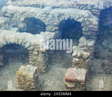 Excavation of an old ancient Roman brick wall with visible corner ...