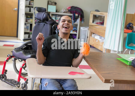Boy with Spastic Quadriplegic Cerebral Palsy using using his helmet and ...