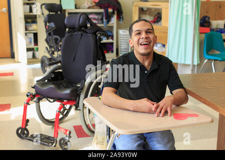Boy with Spastic Quadriplegic Cerebral Palsy using using his helmet and ...