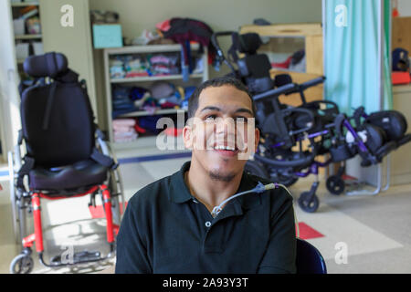 Boy with Spastic Quadriplegic Cerebral Palsy using using his helmet and ...
