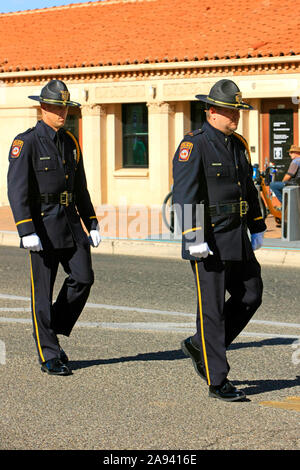 Two male Tucson Police officers and two firemen in their dress uniforms ...