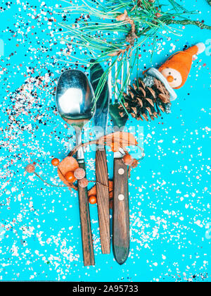 Festive table cutlery with snowman, cone, colorful confetti, and red ...