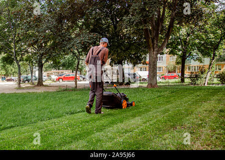 Close-Up Of Lawn Mower On Field Stock Photo - Alamy
