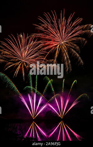 Spectacular display of firework over water Stock Photo - Alamy