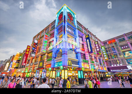 GUANGZHOU, CHINA - MAY 25, 2014: Pedestrians pass through Shangxiajiu ...