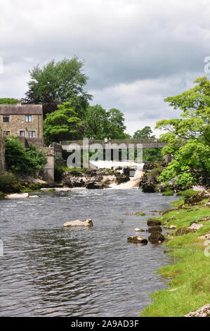 Footbridge over the river Wharfe at Linton Falls Weir in North ...