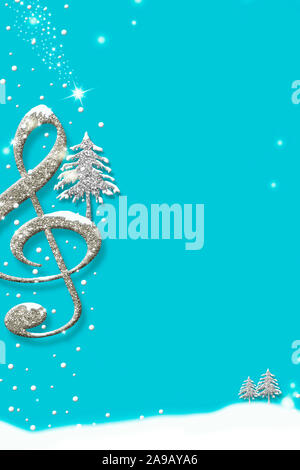 Christmas musical card. Treble clef and fir trees silver glitter ...