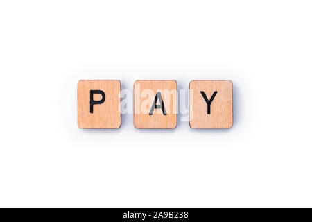 The word PAY, spelt out with wooden letter tiles Stock Photo - Alamy