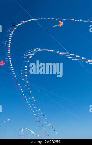 Kite competition on a sunny hot day. Colorful, creative kites fly ...