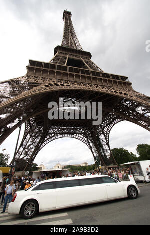 White stretch limo parked below the Eiffel Tower, Paris, France Stock ...