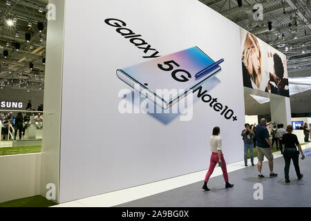 Samsung mobile phone advertising poster in shop window Stock Photo - Alamy