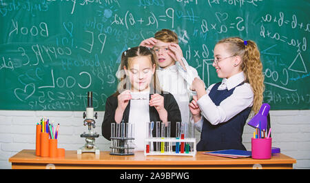 Happy children friendship. Teamwork. students doing science experiments ...