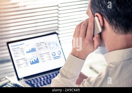 Male financial manager working in the office Stock Photo - Alamy