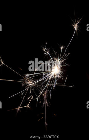 An image of a typical sparkler with dark background Stock Photo - Alamy