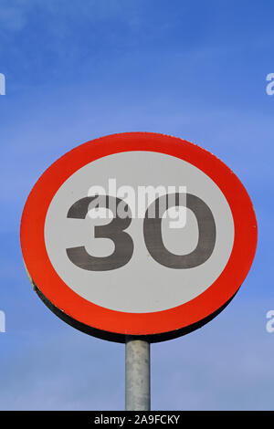 30mph maximum speed limit sign on a road in a small town in the UK ...