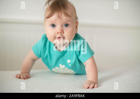 baby trying to stand up Stock Photo - Alamy