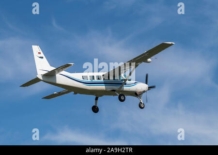 Single-engined propeller business plane during take off at a small ...