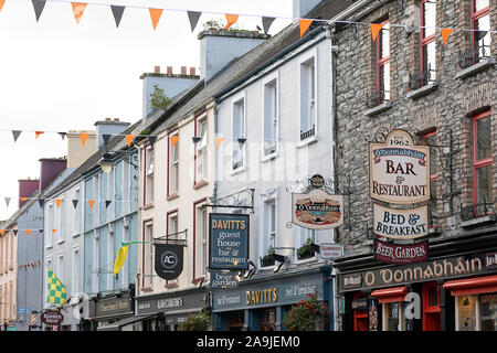 Pubs, shops and restaurants on Main Street, Killarney, County Kerry ...