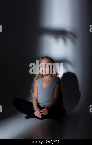 Little Girl Crying With Shadow Of Parents Arguing - Home Violence And ...