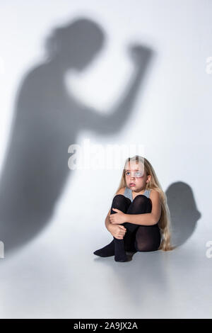 Little Girl Crying With Shadow Of Parents Arguing - Home Violence And ...
