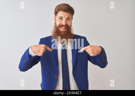 Young redhead irish businessman wearing suit and glasses over isolated ...
