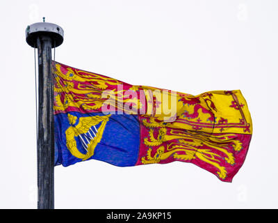 Heraldic flag. The Royal Standard of the United Kingdom blows in the ...