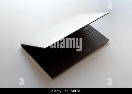 laptop half closed isolated on white background. laptop half closed ...
