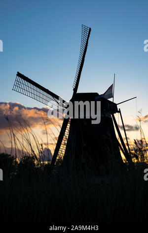 old windmill against the background of the sunset sky Stock Photo - Alamy