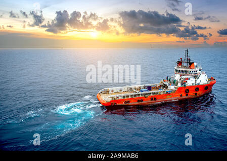 Shipping box is loaded from an offshore rig to the supply vessel Stock ...