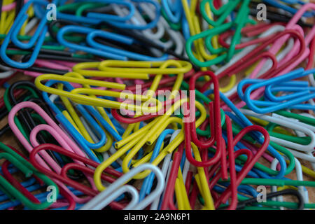 Multicolored paper clips close up isolated on white background ...