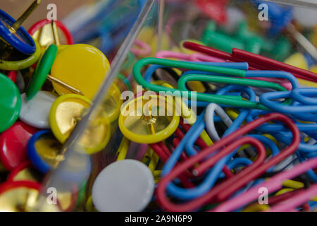 Close up of multicolored paper clips isolated on a white background ...