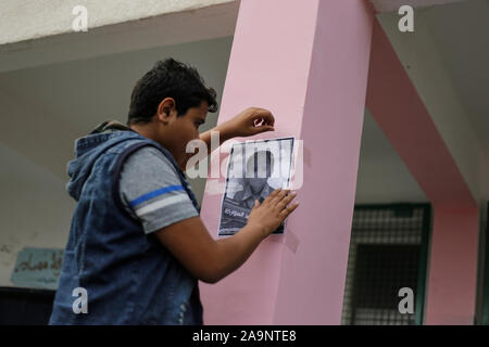 Family Member of people killed in the fire at a makeshift memorial set ...