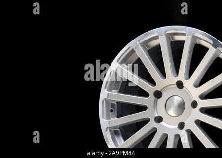 multi-spoke silver wheel, close-up on a black background Stock Photo ...