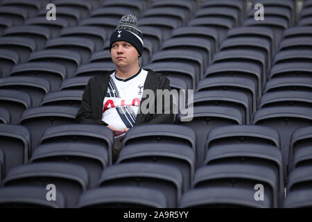 A Tottenham Hotspur fan in the stands with a homemade tin foil trophy ...