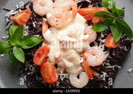 Squid Ink Pasta with , parmesan, basil leaves. Black spaghetti, black ...