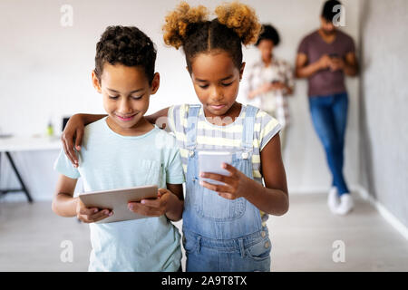 Family using electronics gadgets Stock Photo - Alamy
