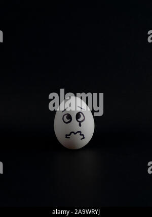 Happy, angry, scared and sad eggs in their box Stock Photo - Alamy